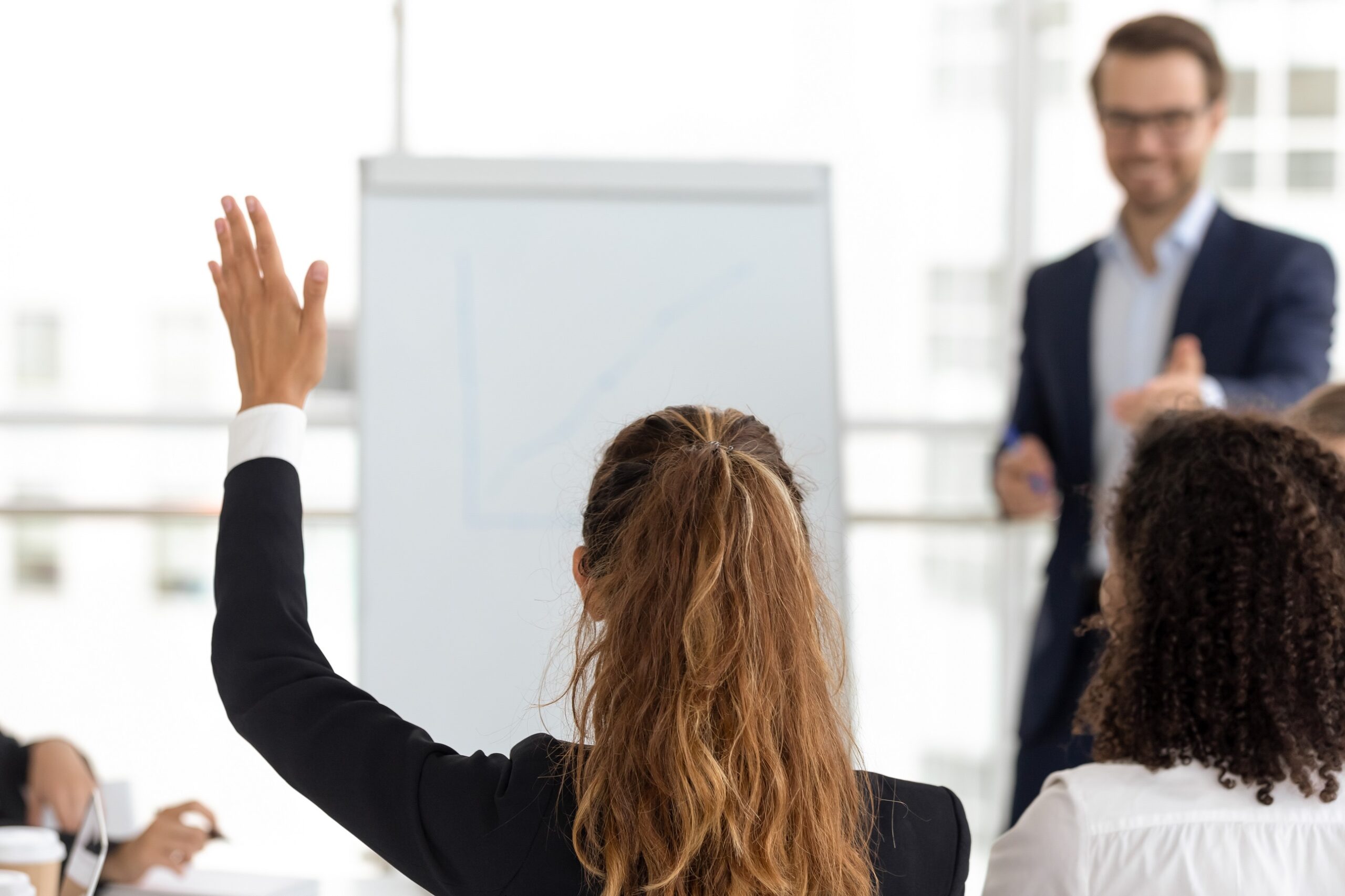 woman-raising-hand-asking-question - MEDSURETY
